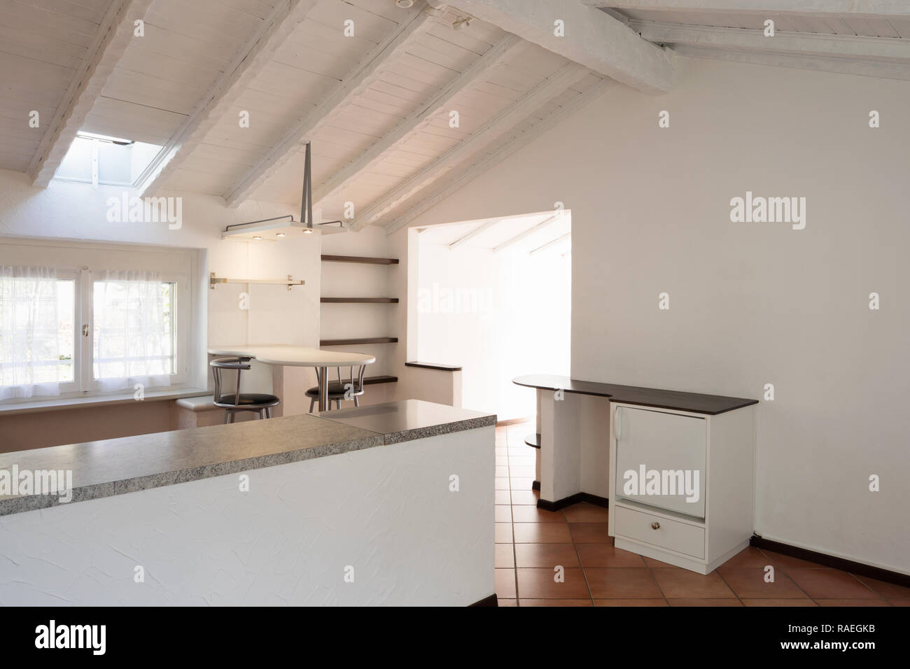 White wall with small furniture to support objects. Copy-space Stock ...