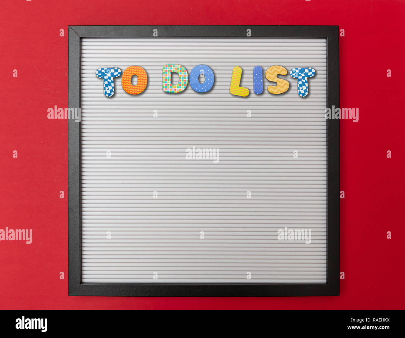 To do list. Board with black frame, text To do list in colorful letters ...