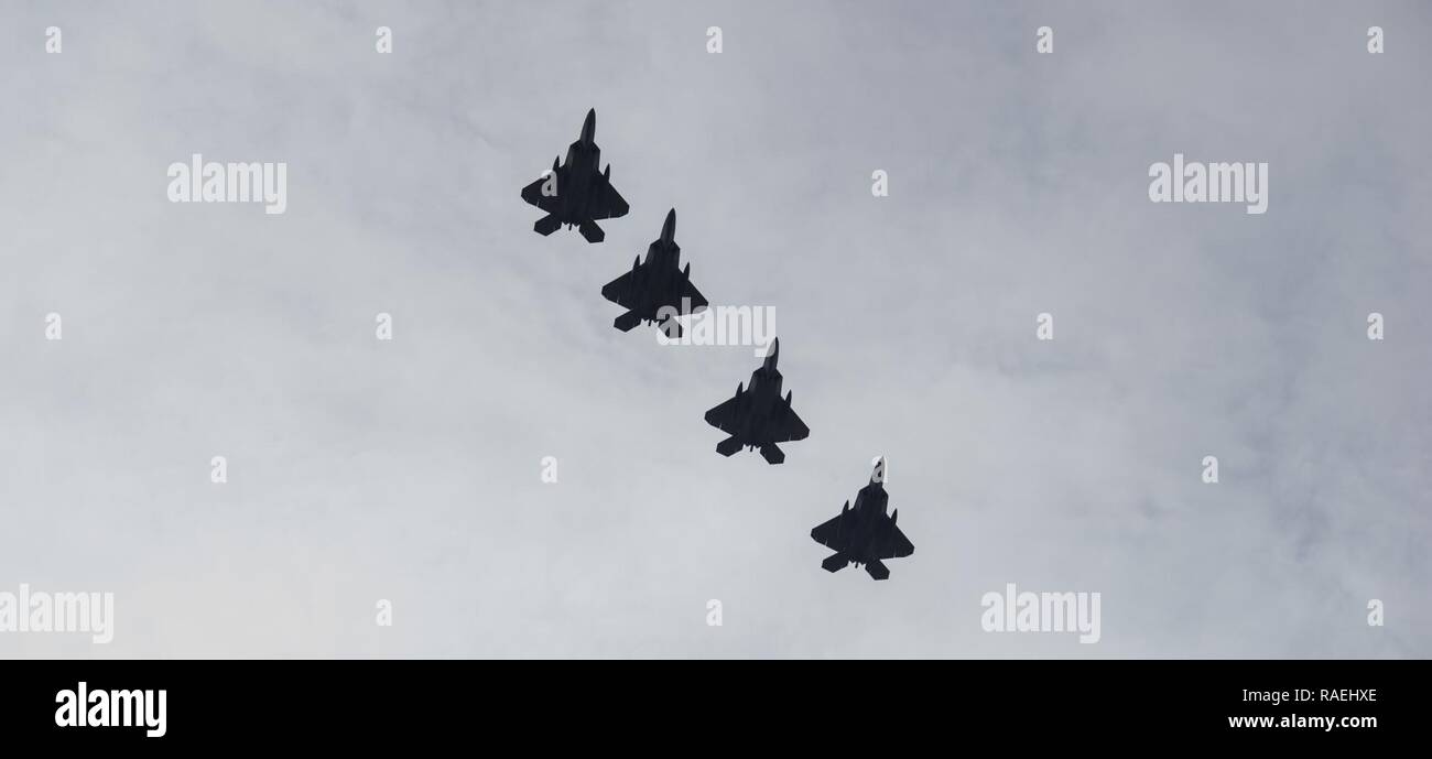 Four F-22 Raptors from Joint Base Elmendorf-Richardson, Alaska, fly ...