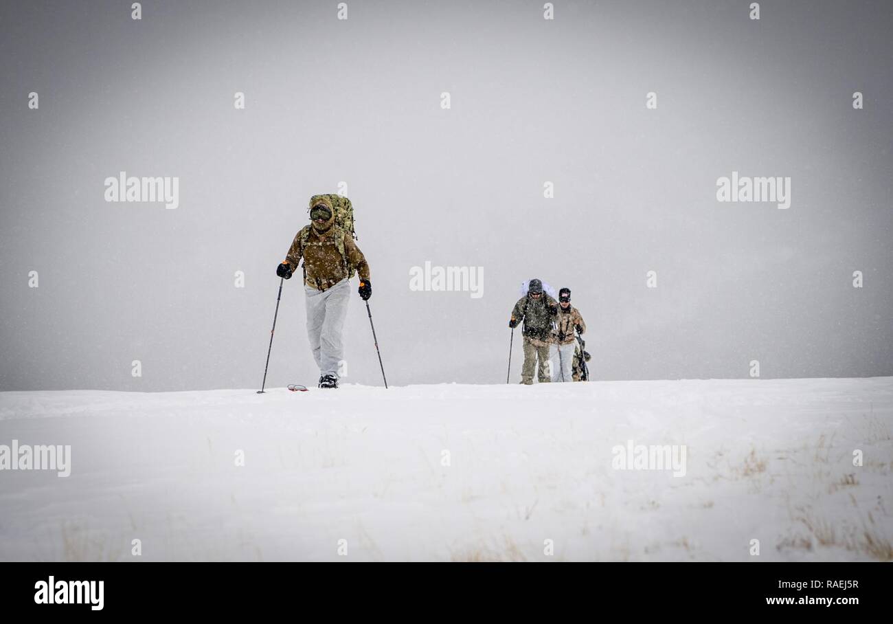 East coast-based Navy SEALs forge a trail in the backcountry using skis ...