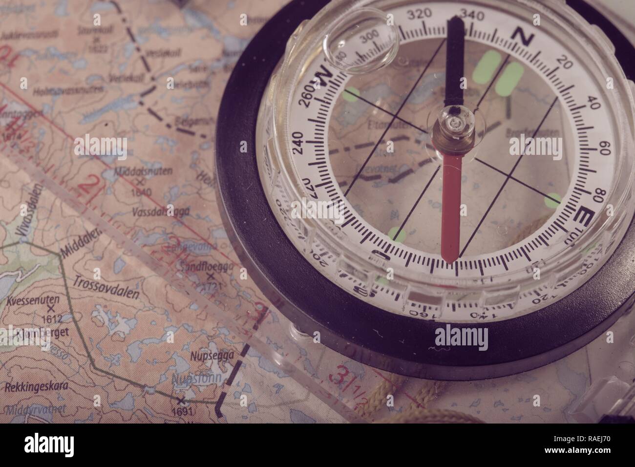 retro style abstract shoot with the compass on a map Stock Photo - Alamy