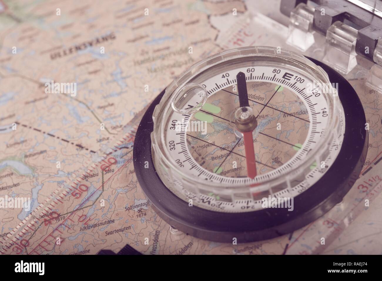 retro style abstract shoot with the compass on a map Stock Photo - Alamy