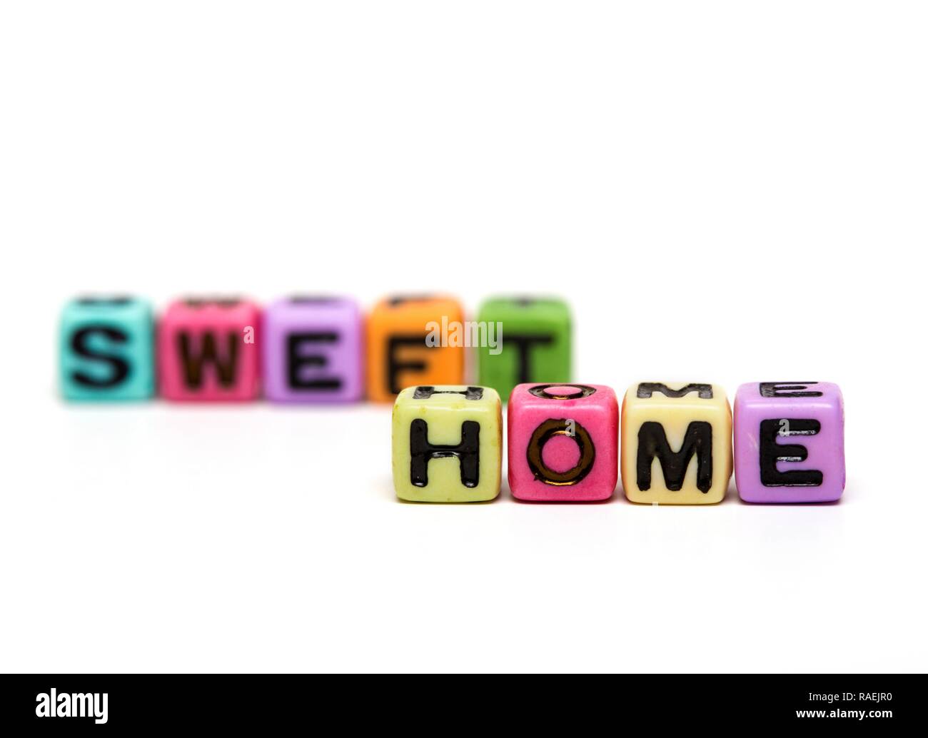 sweet home - word made from multicolored child toy cubes with letters ...