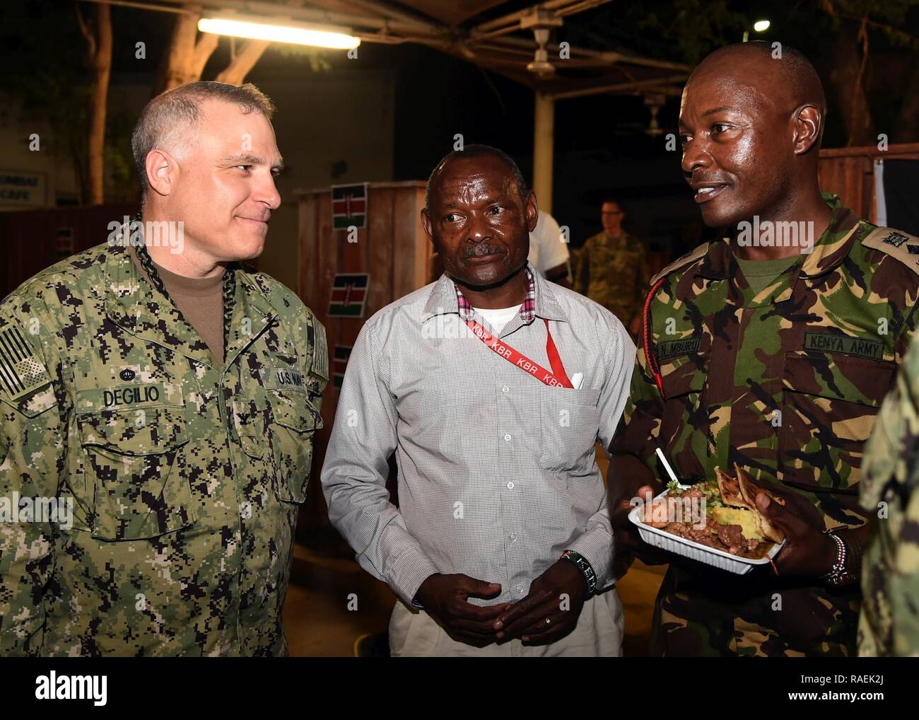 U.S. Navy Capt. Charles J. DeGilio (left), commanding officer, Camp ...