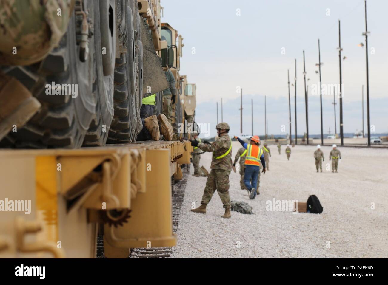 Civilians and U.S. army personnel work together as a team to conduct ...
