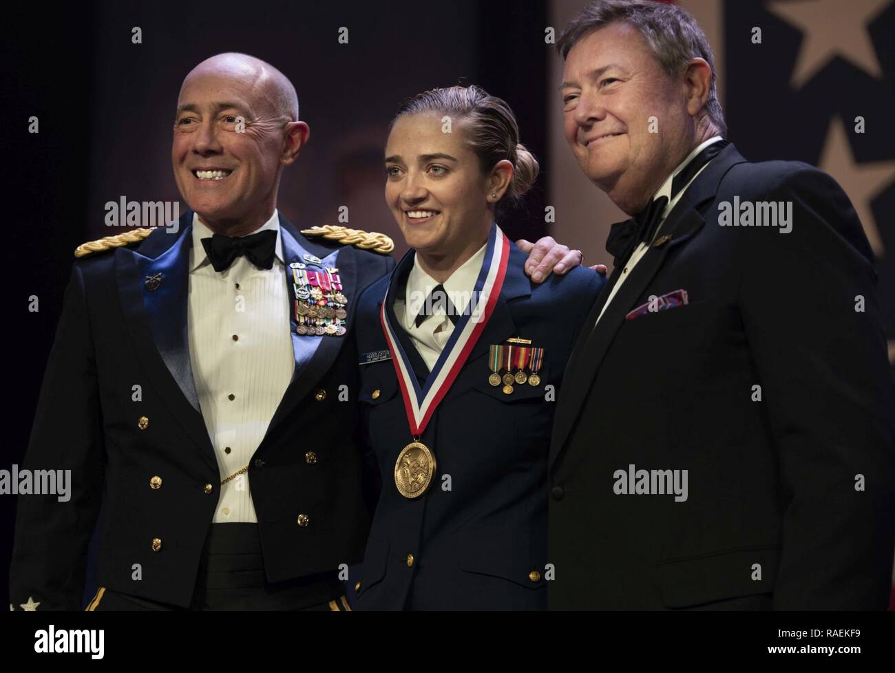 Coast Guard Petty Officer 2nd Class Traci Huddleston (middle) smiles ...
