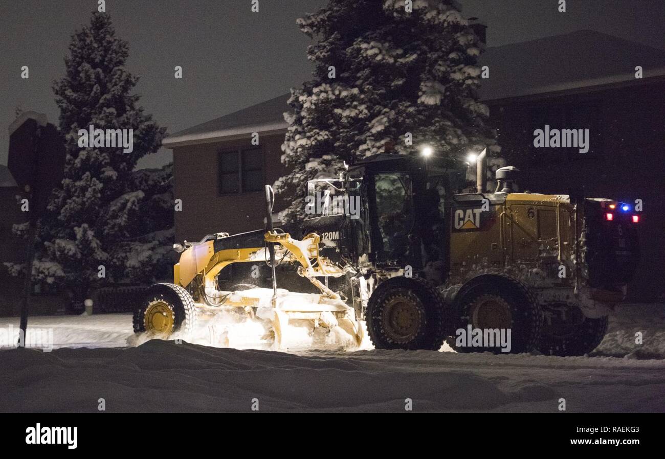 A member of the 773d Civil Engineer Squadron snow barn removes snow ...