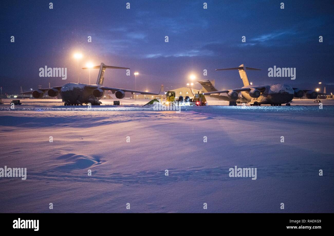A member of the 773d Civil Engineer Squadron snow barn removes snow ...