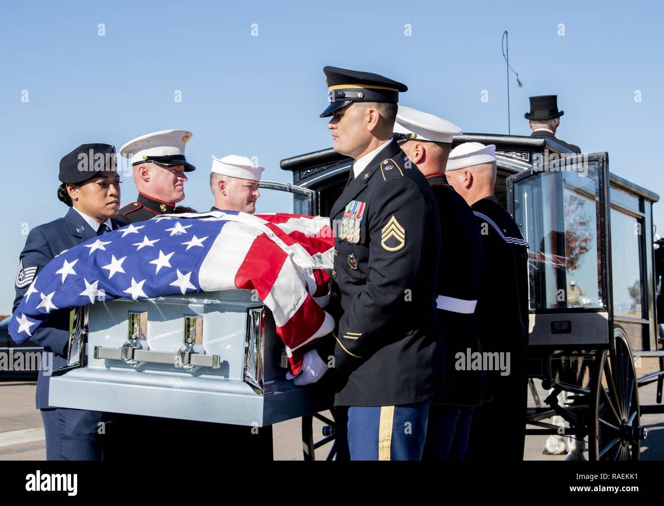 SAN DIEGO (Dec. 13, 2018) A honor team escorts the casket containing ...