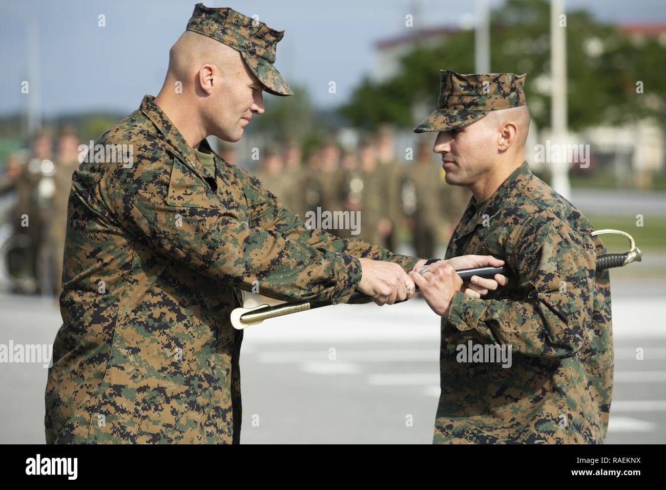 Lt. Col. Michael T. Hlad passes the noncommissioned officer sword of ...