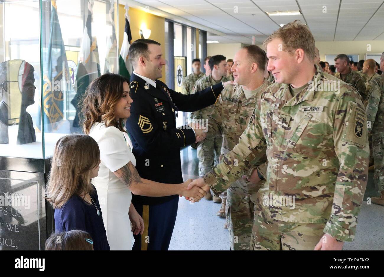 Sergeant 1st Class Erik Kingsley, shakes hands with Soldiers, following ...