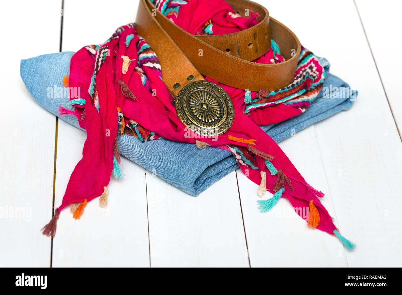 accessories on a white background - scarf, belt, jeans Stock Photo - Alamy