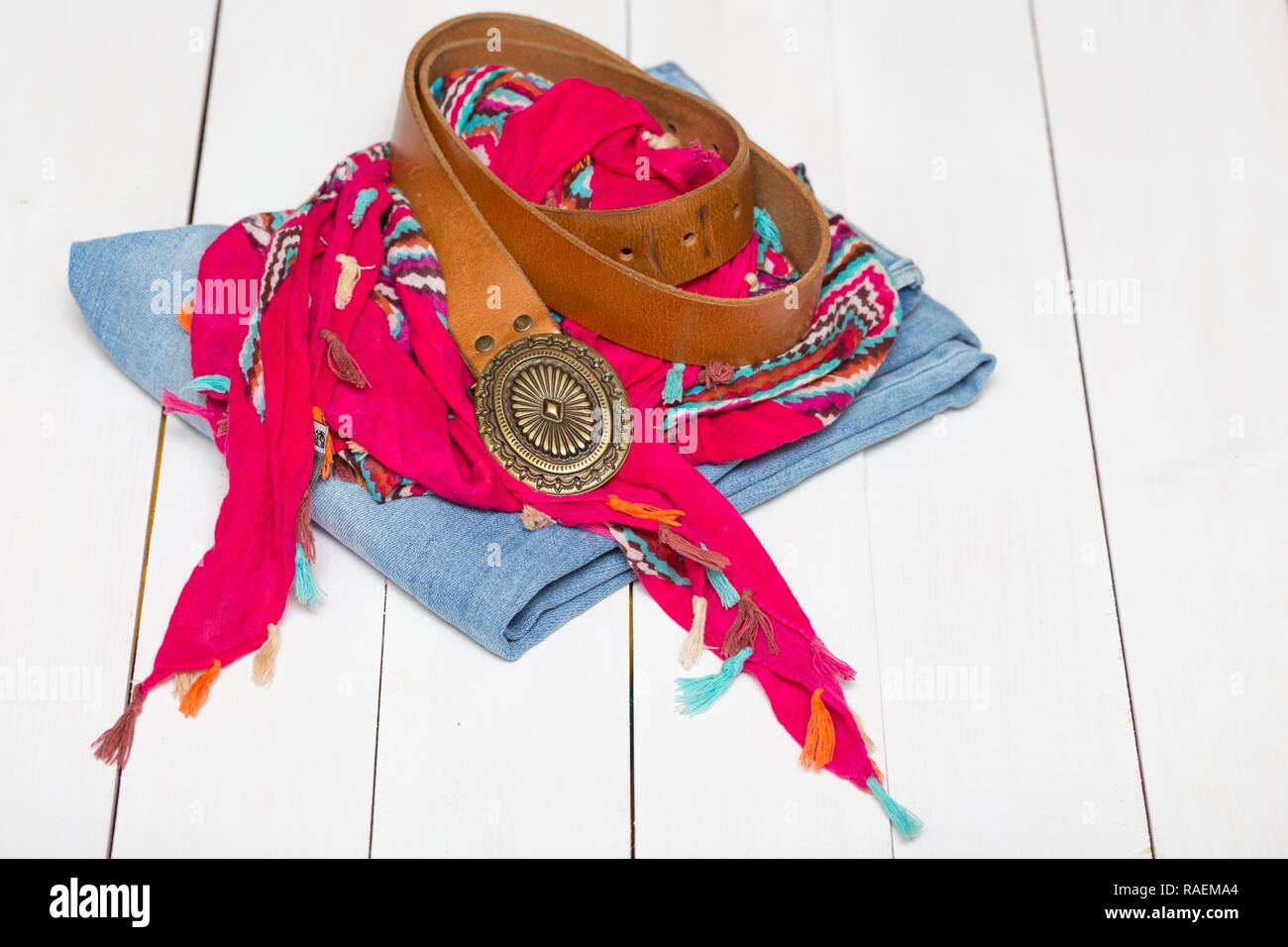 accessories on a white background - scarf, belt, jeans Stock Photo - Alamy