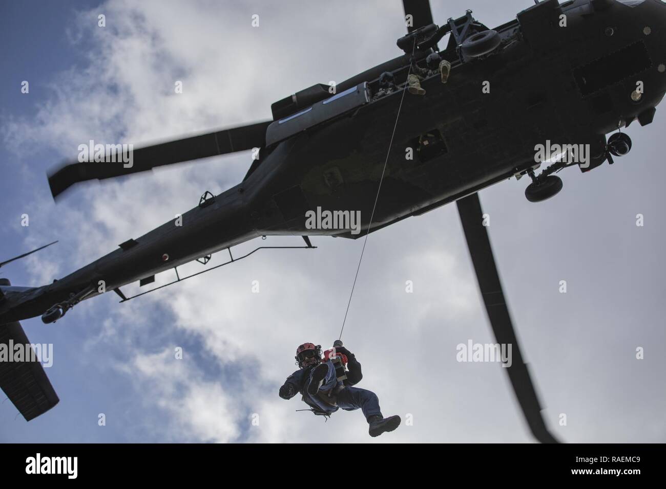 New Jersey Task Force One rescueman Bill Szemcsak descends from a New ...
