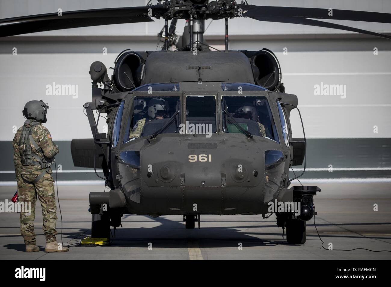 A U.S. Army aircrew readies a UH-60L Black Hawk MEDEVAC helicopter for ...