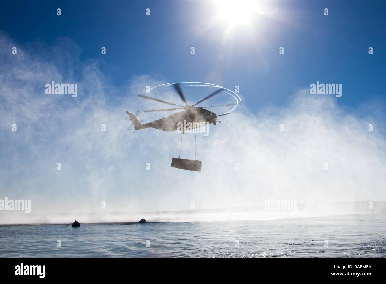 A U.S. Marine Corps CH-53E Super Stallion drops an improved ribbon ...