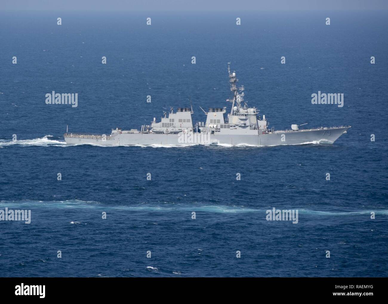 The guided-missile destroyer USS Decatur (DDG 73) sails in formation ...