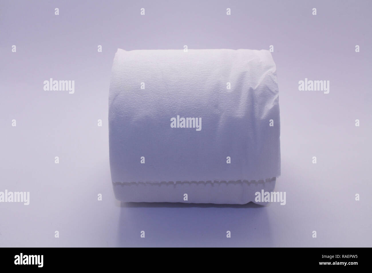 A roll of toilet paper or tissue (British). Taken with white background ...