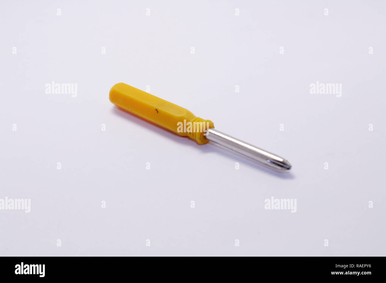 The yellow screwdriver, used for screwing and unscrewing. Useful Stock ...
