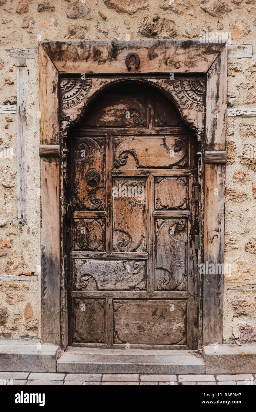 Beautiful old wooden brown door with handle in ancient city of Antalya ...