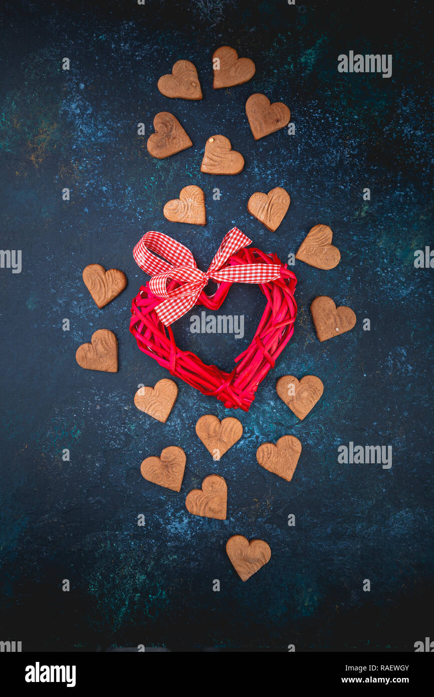 Valentine cookies with heart shape and decorative heart on dark blue ...