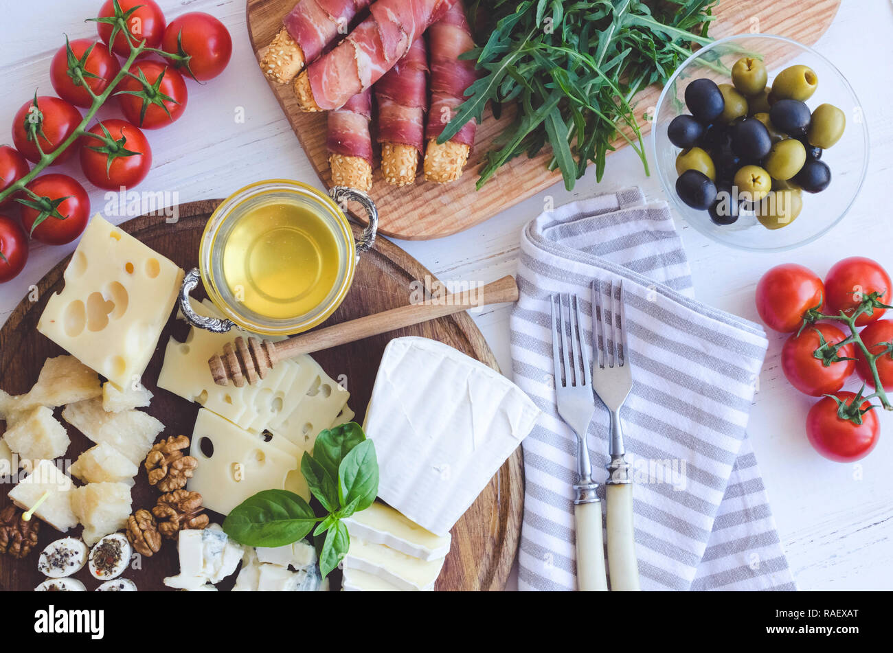 Table full of mediterranean appetizers, tapas or antipasto. Assorted ...
