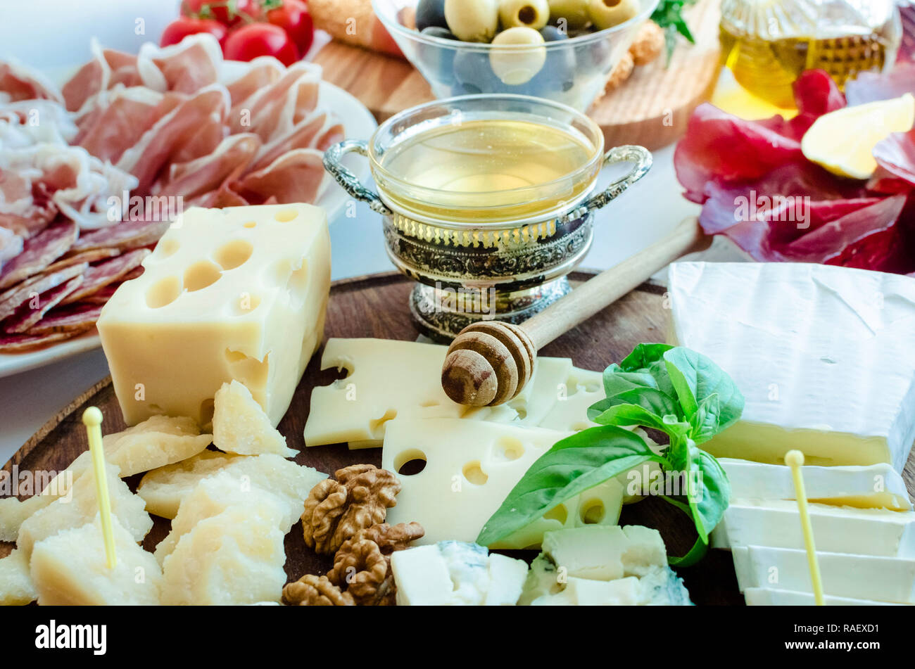 Table full of mediterranean appetizers, tapas or antipasto. Assorted ...