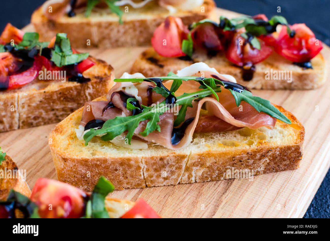 Selection of tasty Italian bruschetta or canapes on toasted baguette ...