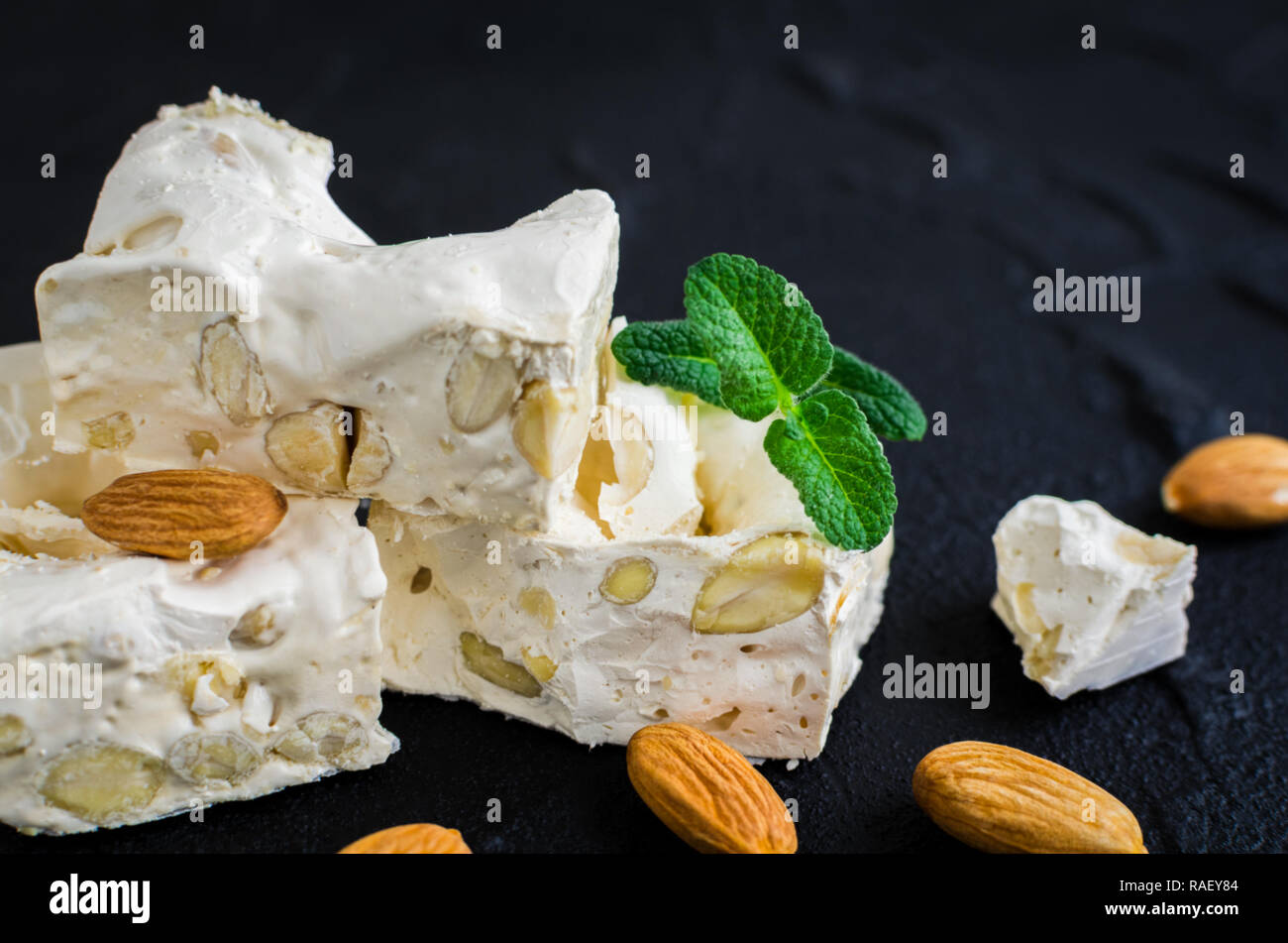 Delicious traditional Italian festive torrone or nougat with nuts on ...