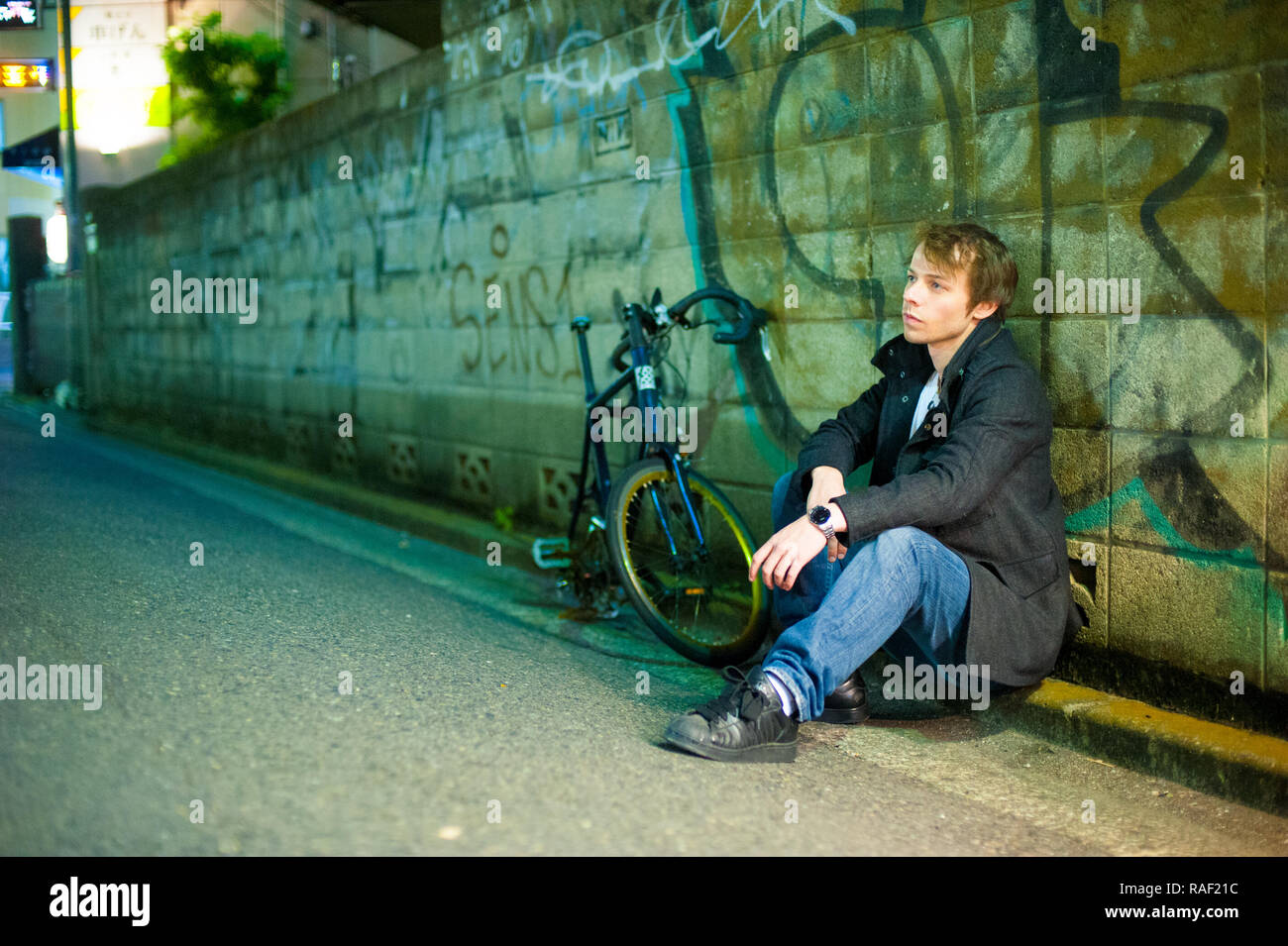 Caucasian male model poses for pictures on the street Stock Photo - Alamy