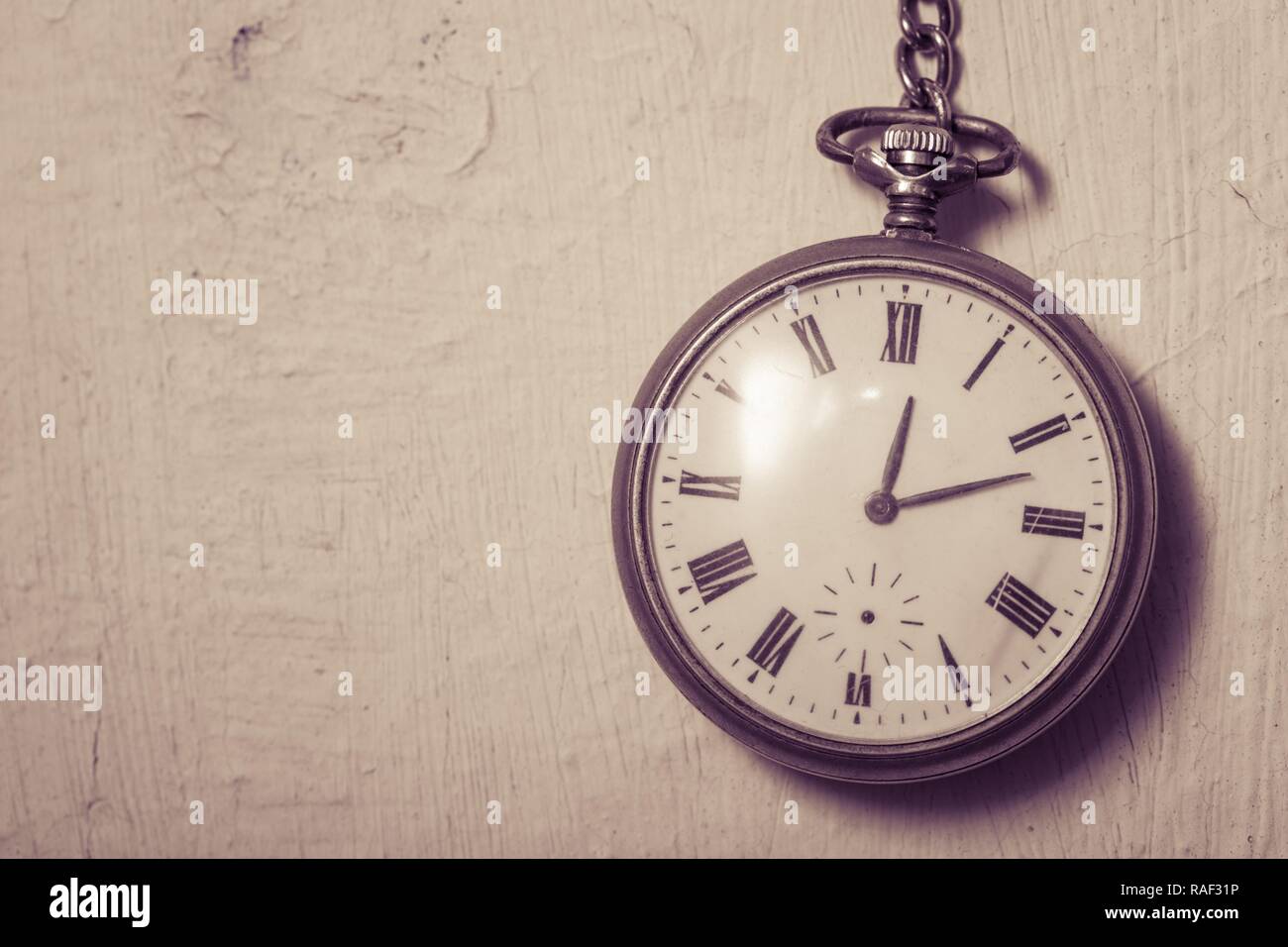 abstract grunge background with old-fashioned retro watch with chain ...