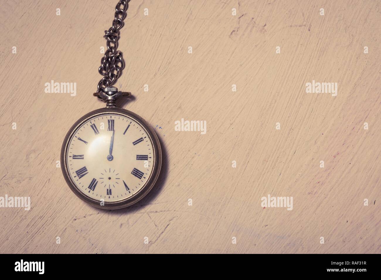 abstract grunge background with old-fashioned retro watch with chain ...