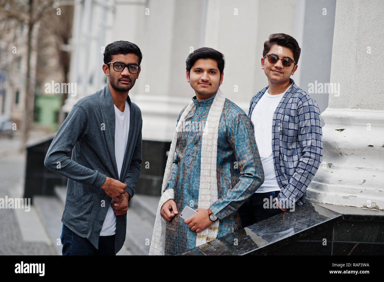 Group of three south asian indian mans in traditional and casual wear ...