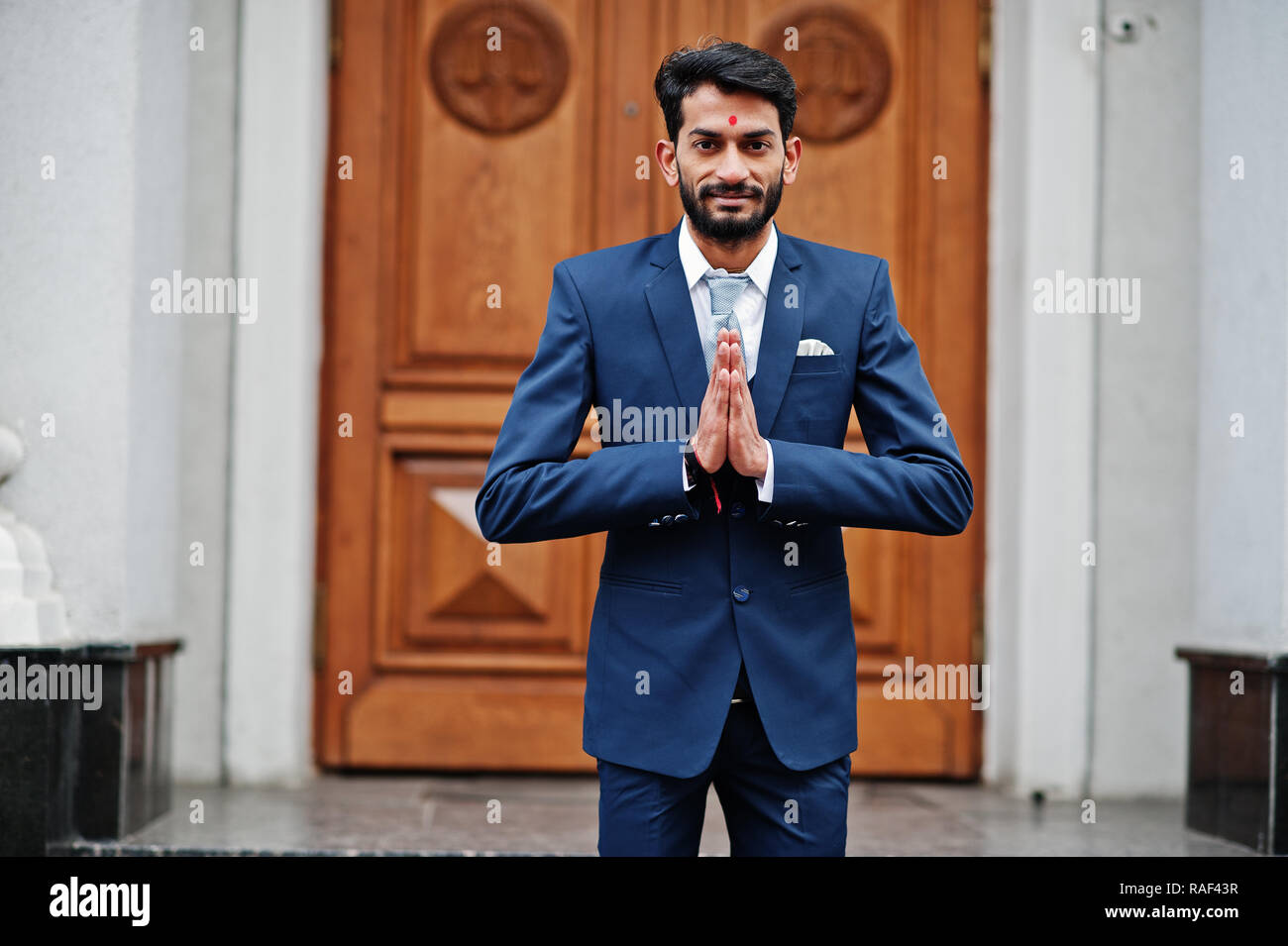 Stylish beard indian man with bindi on forehead, wear on blue suit ...