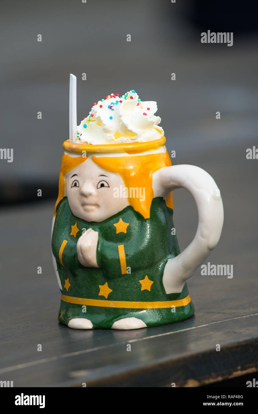 Punsch topped with whipped cream in ceramic mug at Christmas Market at ...