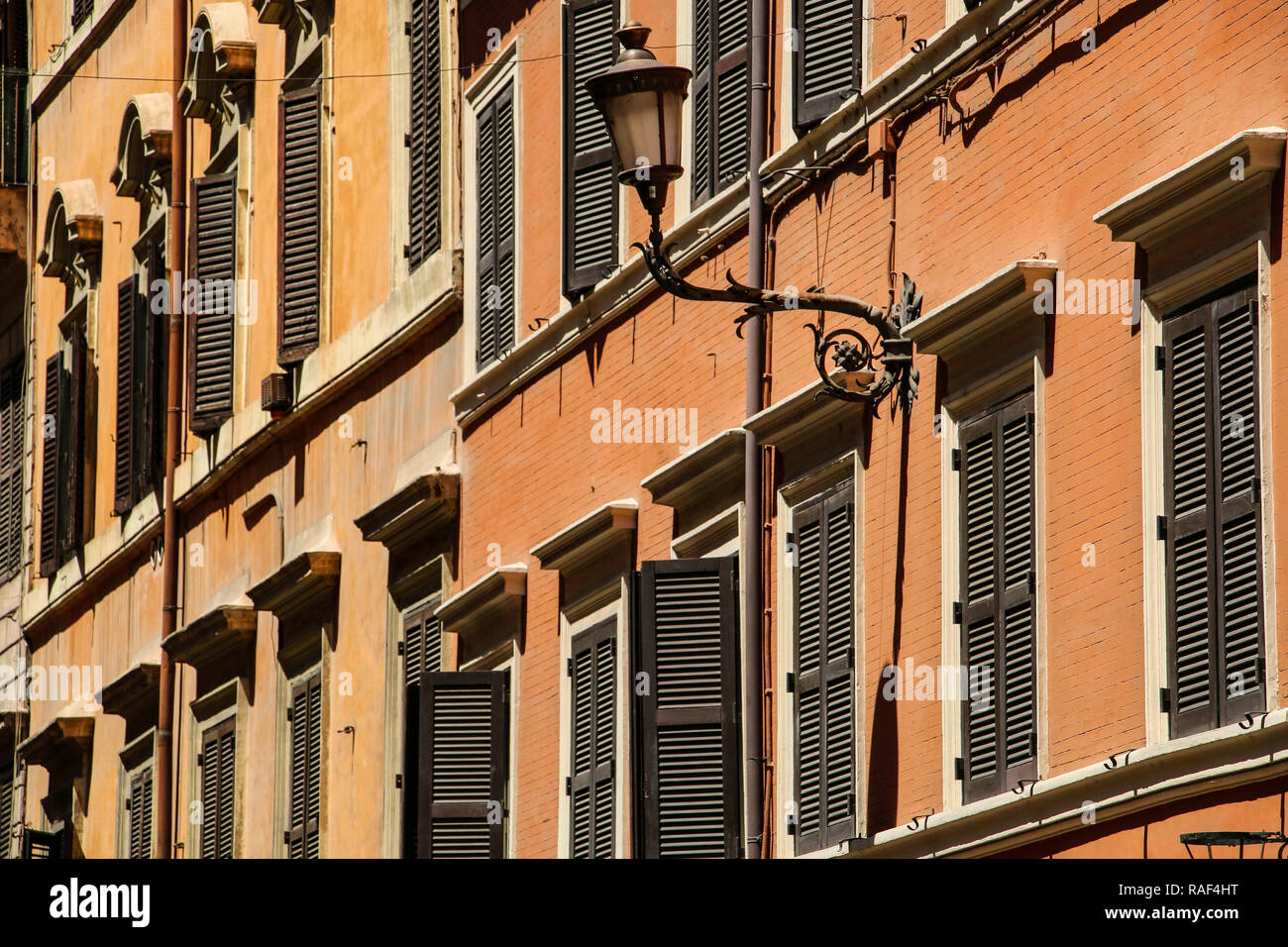 Traditional Italian windows with shutters in one of the houses of Rome ...