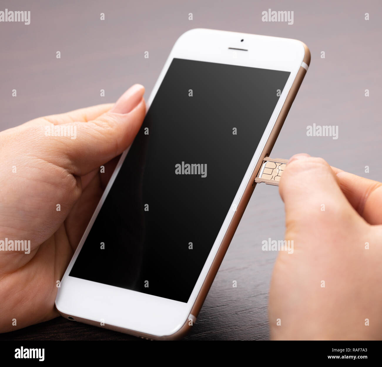 sim card and mobile phone in female hands Stock Photo - Alamy