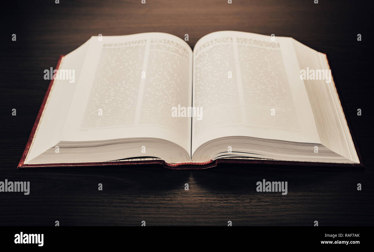 new open book close-up on wooden background Stock Photo - Alamy