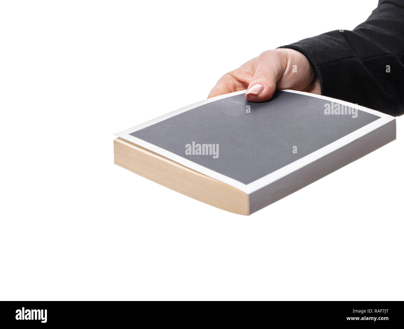 female hand holding book on white isolated background Stock Photo - Alamy