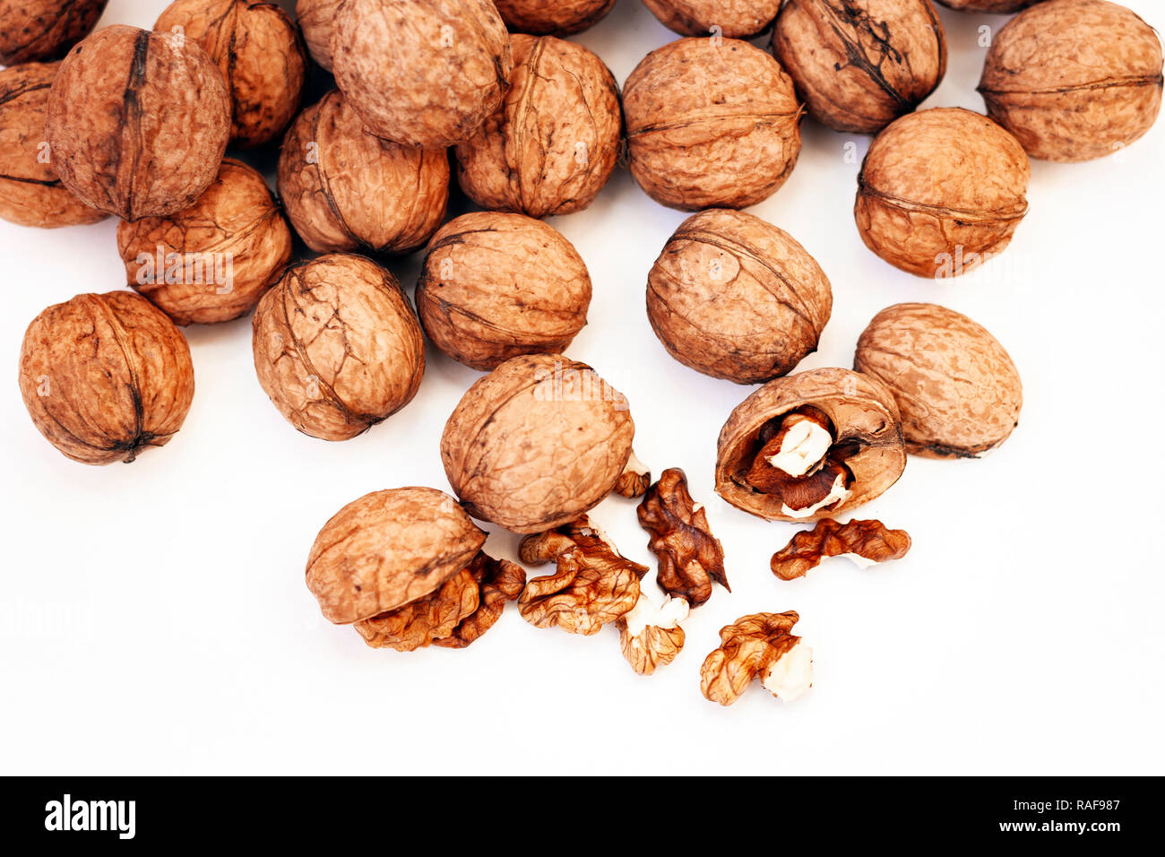 Whole walnuts kernels on white background Stock Photo - Alamy