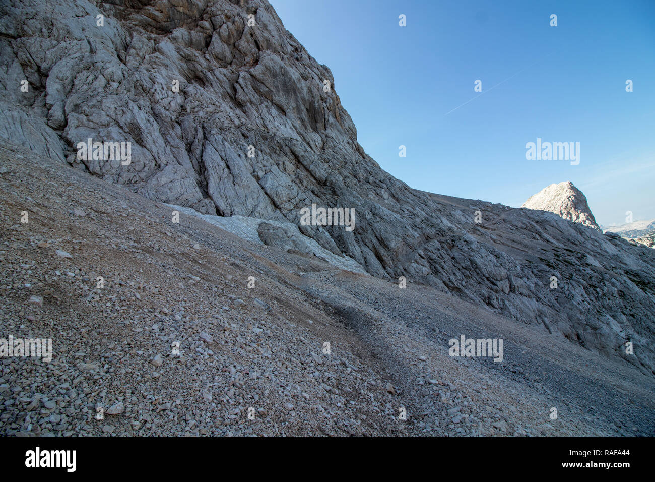 mountain path high in mountains with some snow Stock Photo - Alamy