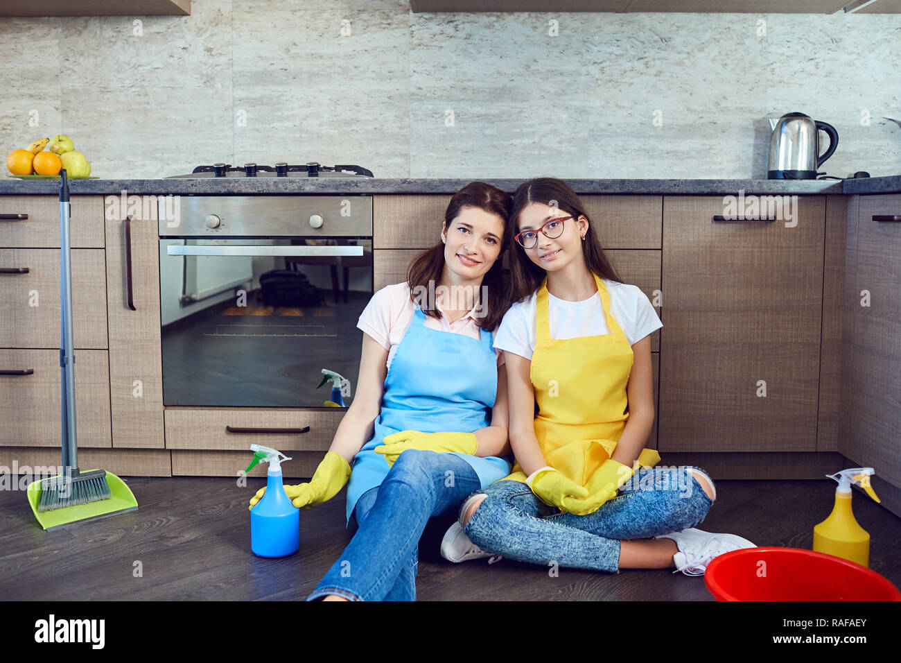 Mother and daughter cleaning the house Stock Photo - Alamy