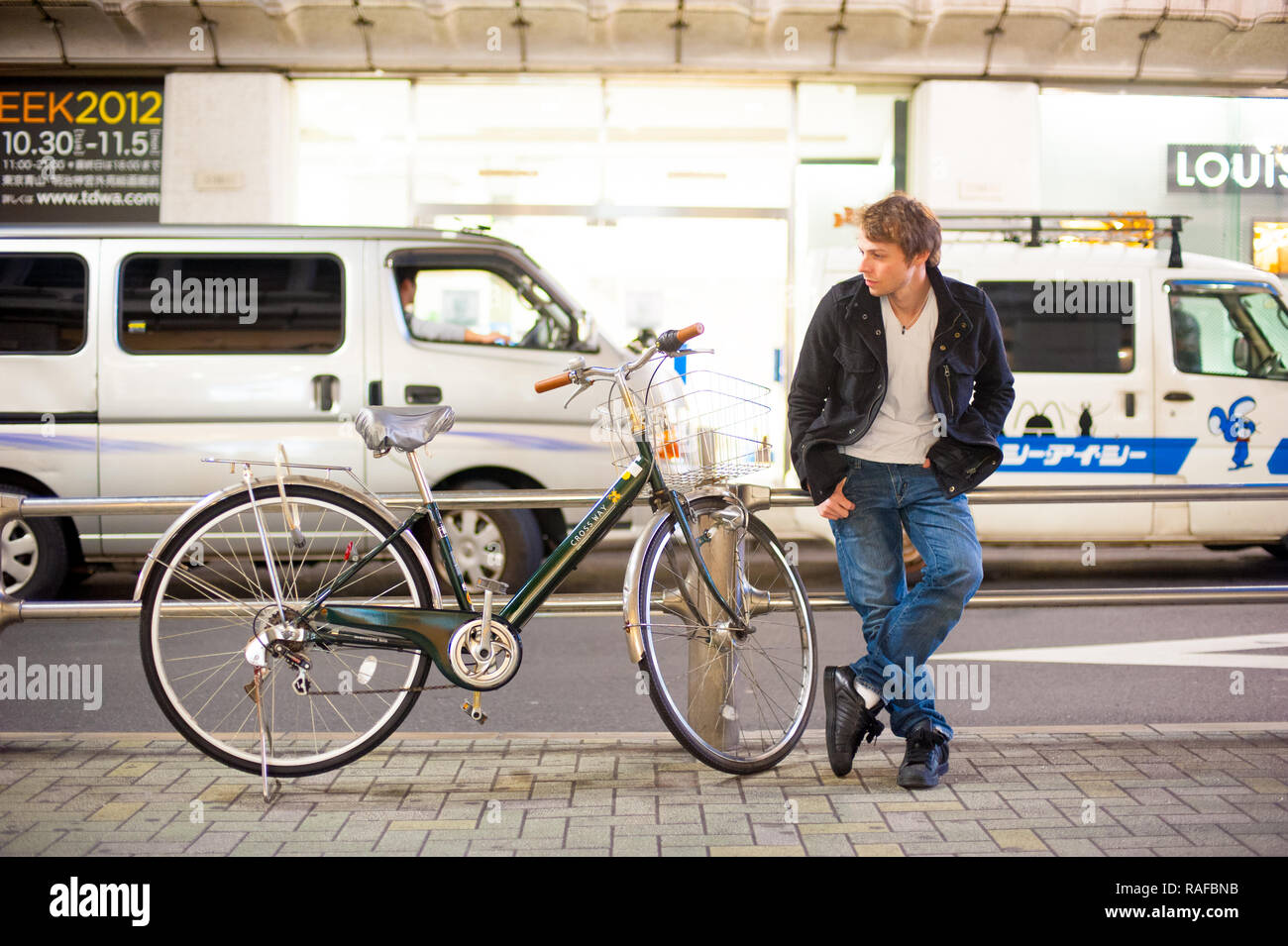 Caucasian male model poses for pictures on the street Stock Photo - Alamy