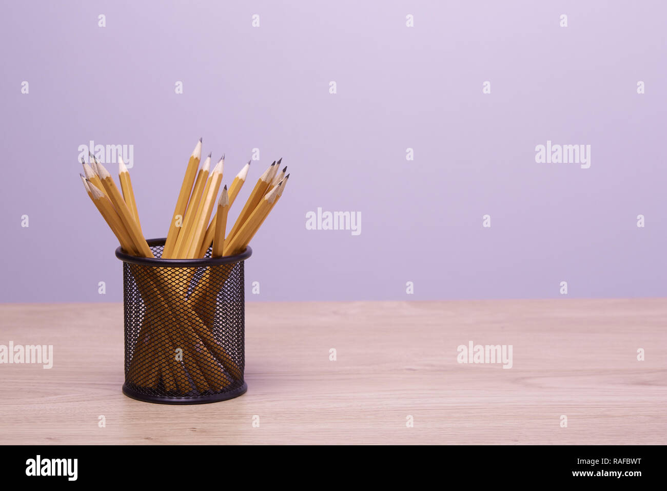 Graphite pencils in a metal grid-container. Concept Stock Photo - Alamy