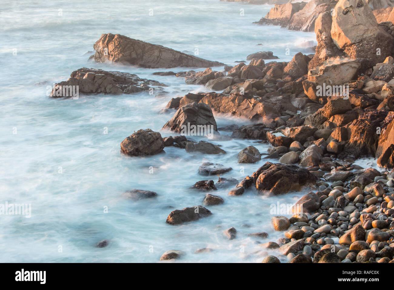 The cold waters of the Pacific Ocean wash against the scenic Northern ...