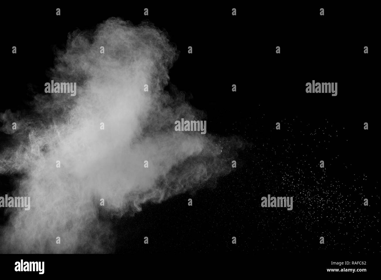 Abstract white powder explosion against black background.Abstract white ...