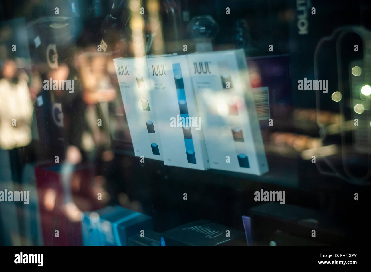 A selection of the popular Juul brand flavored vaping supplies on ...