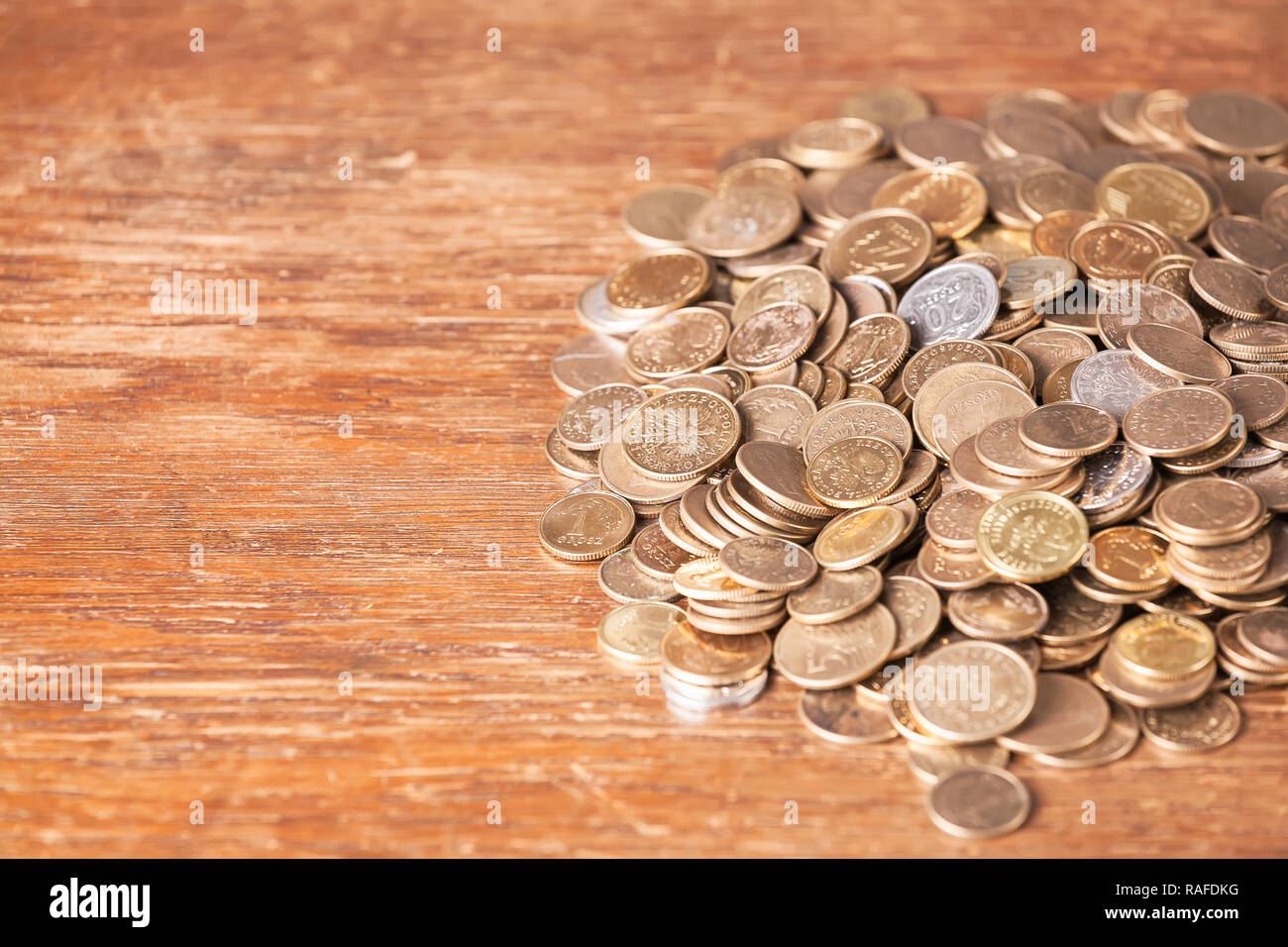 Money coin spare change pile dark wood background concept Stock Photo ...