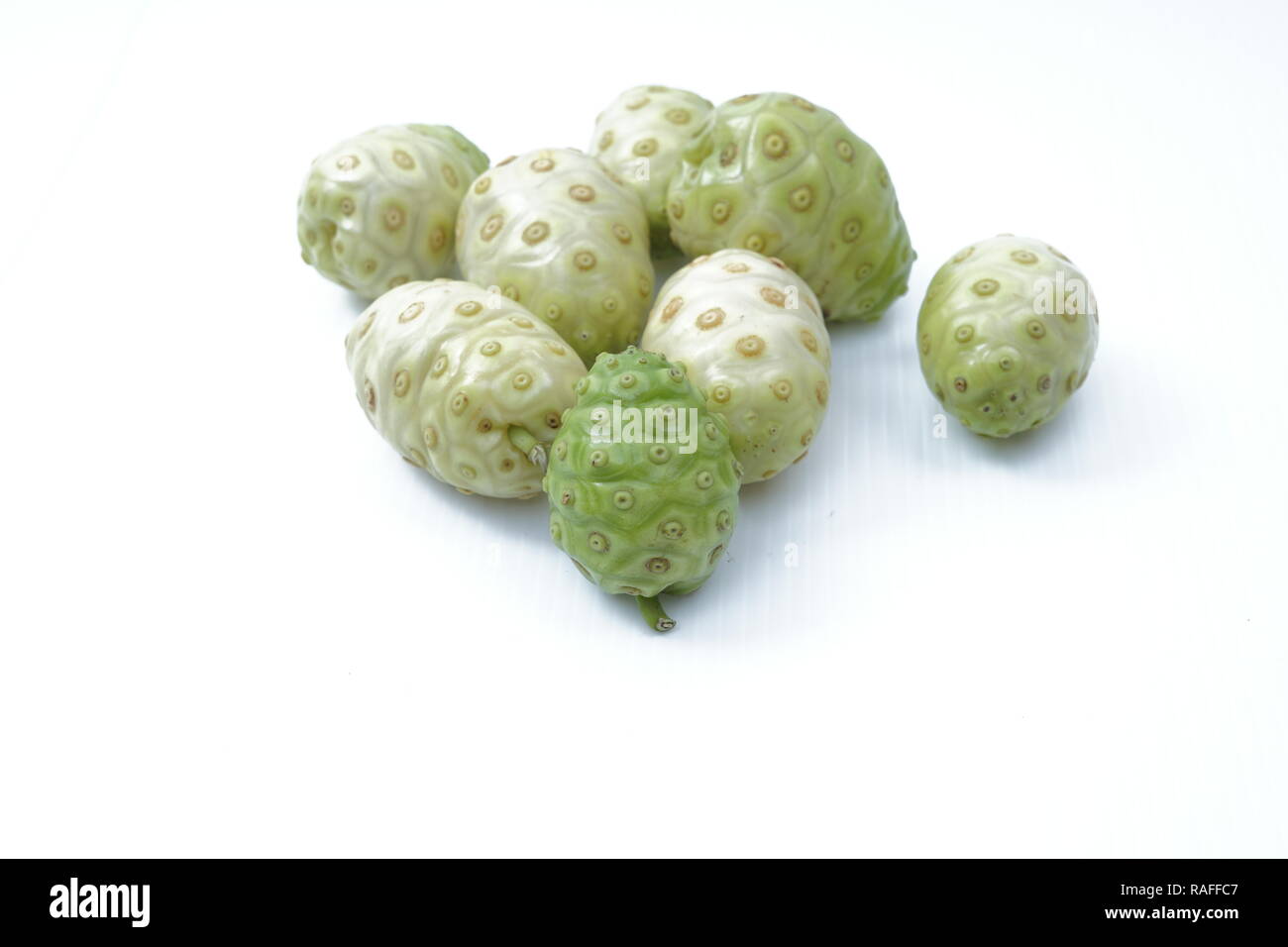 Noni or Morinda citrifolia fruit on white background Stock Photo - Alamy