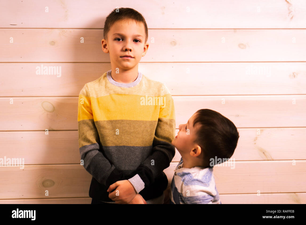 Two brothers - the elder brother and the younger brother, talking in ...